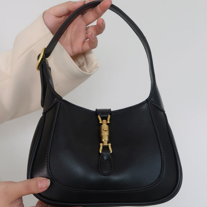 Black Classic Curved Leather Handbag with Signature Buckle Closure ...