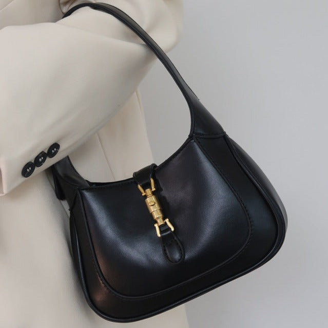 Black Classic Curved Leather Handbag with Signature Buckle Closure ...